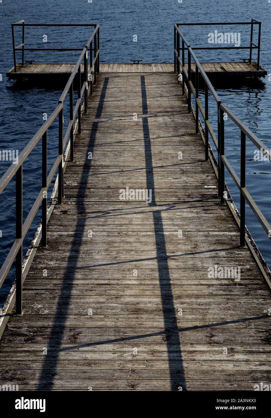 Old timber and steel jetty at a remote scottish loch Stock Photo - Alamy