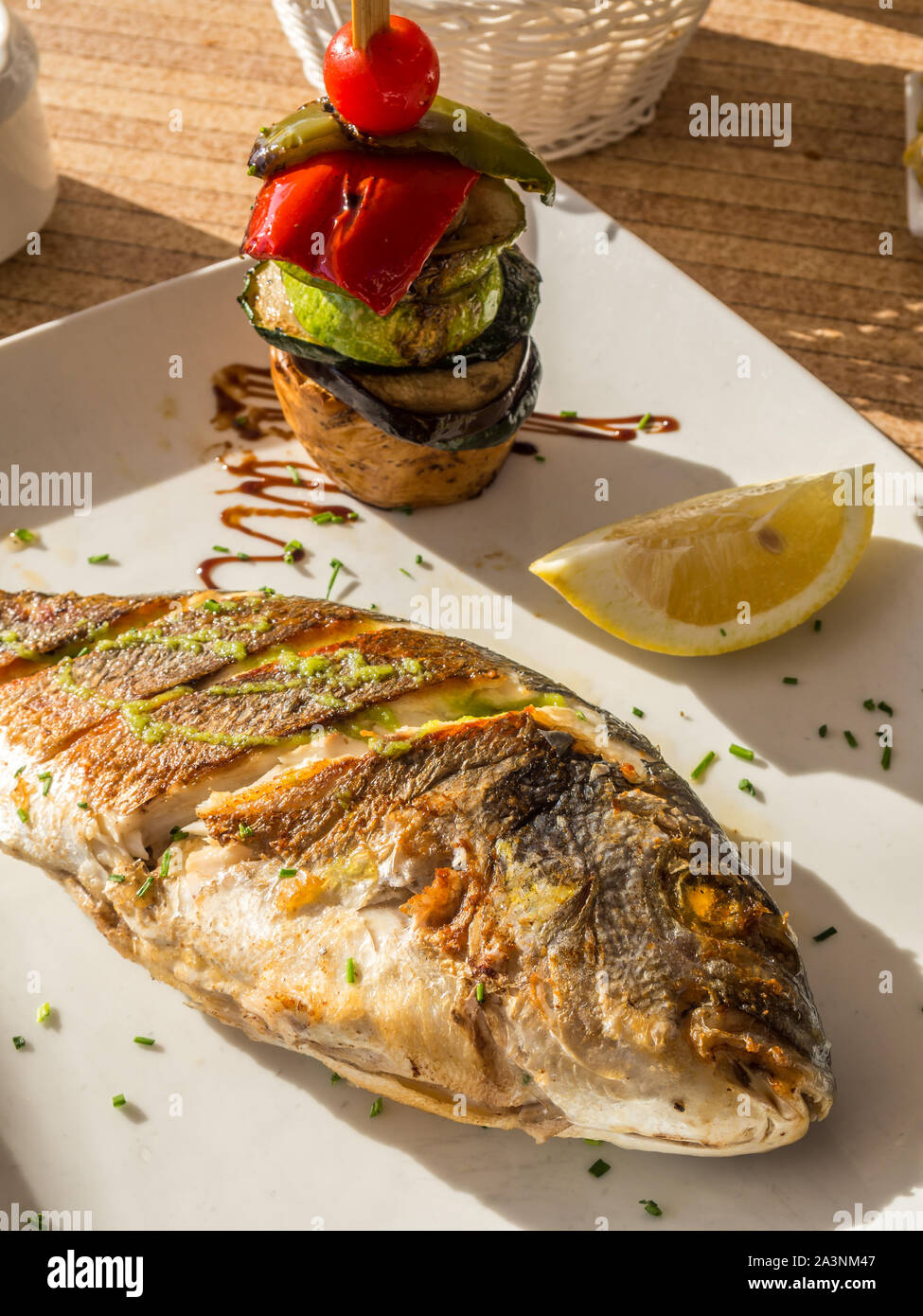 grilled fish in the restaurant Stock Photo - Alamy