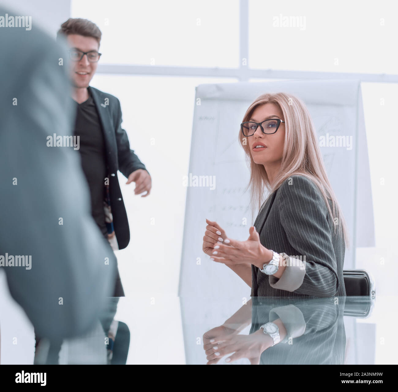 project Manager holds a meeting with a presentation for the business ...