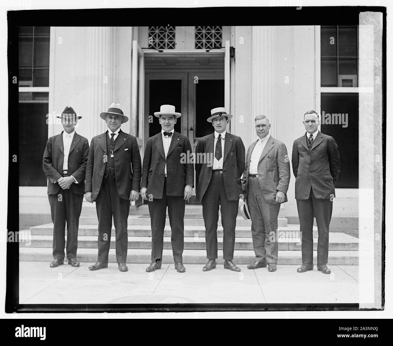 Six men standing in a row at one of the Capitol doors(), Aug. 5, 1920 ...