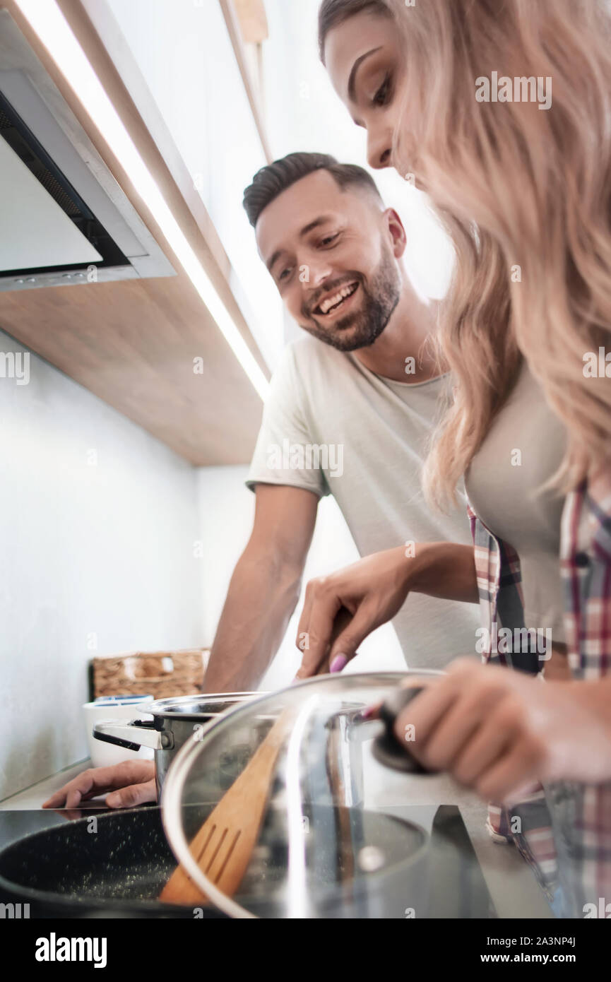 close up. young husband and wife cook dinner together Stock Photo - Alamy