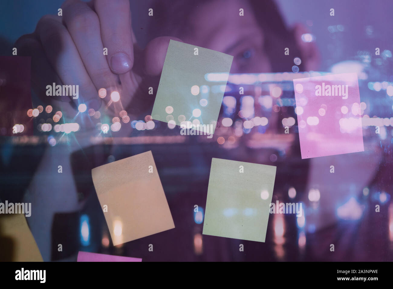 Businessman writing on a sticky note hi-res stock photography and ...