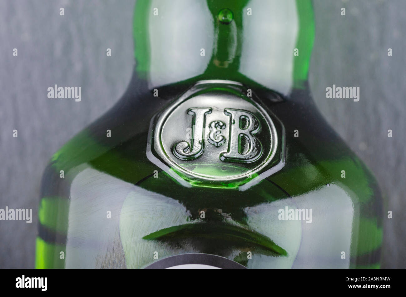 J&B blended scotch whisky on stone slate background. Justerini and ...