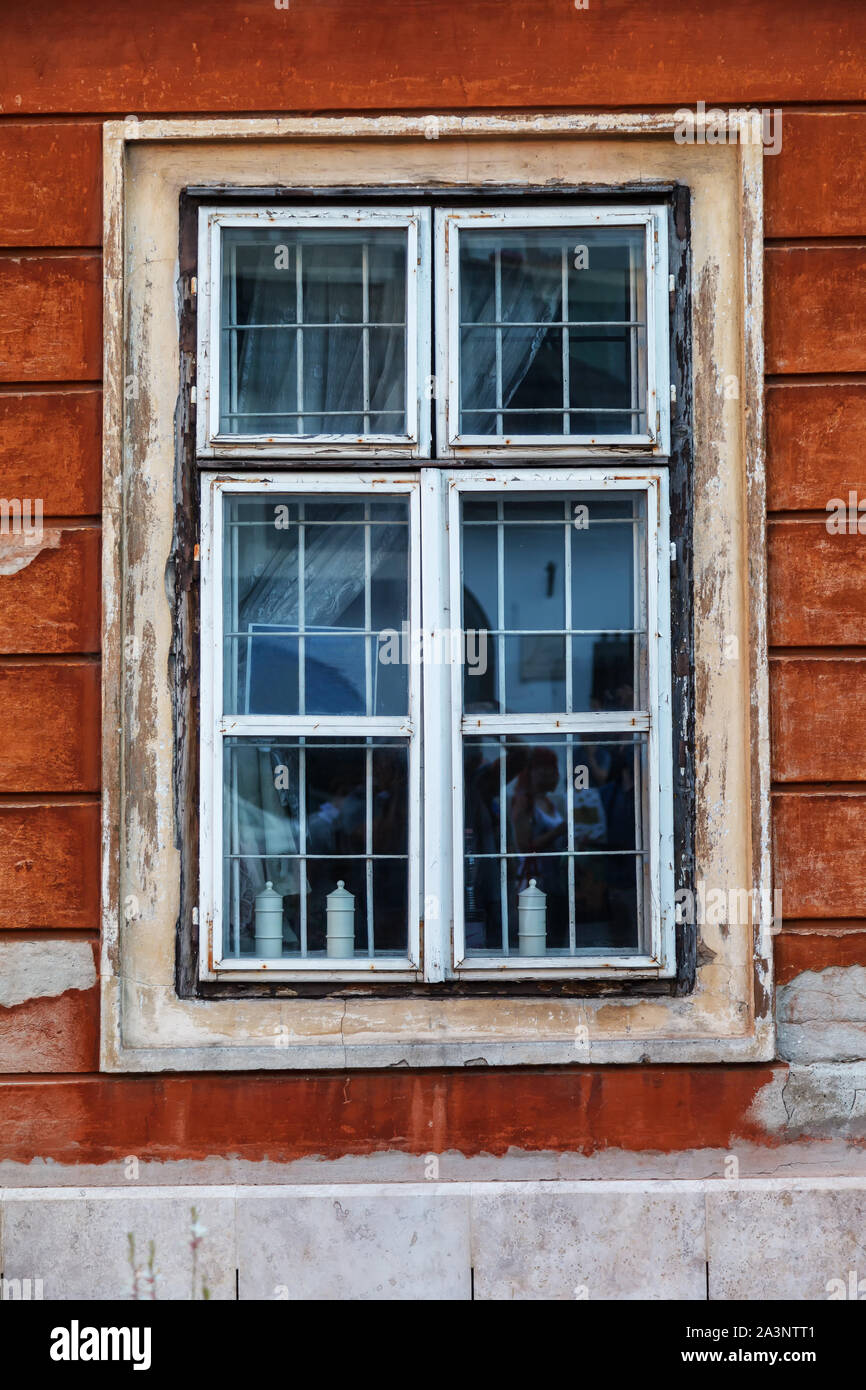 Old vintage wooden window with frames on the wall of the rural house ...