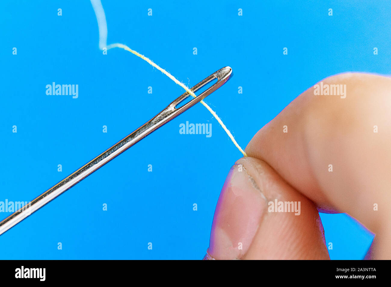 Thread Through Needle High Resolution Stock Photography and Images - Alamy