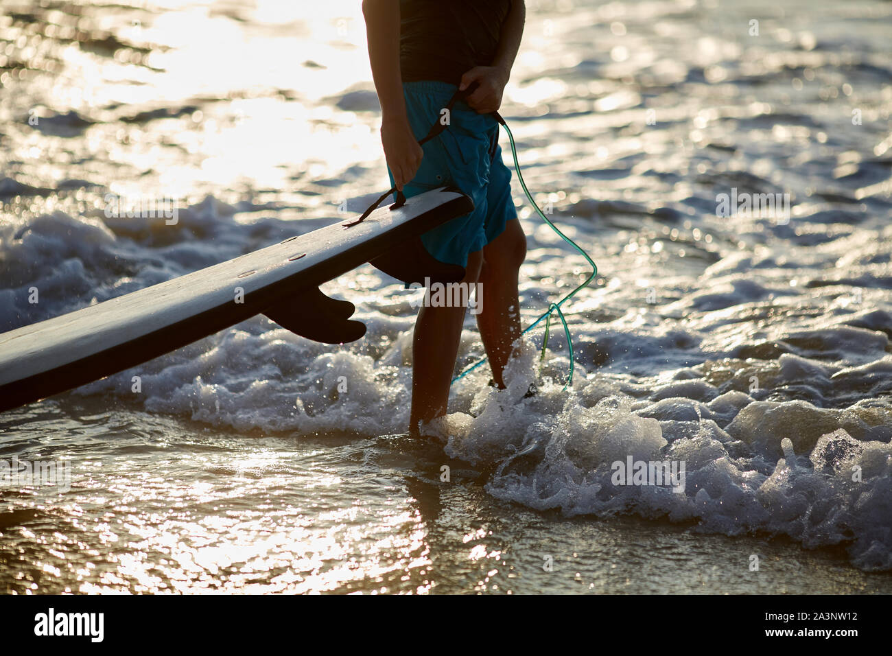 Surf board in surfer's hand close up image with oceans waves view Stock ...