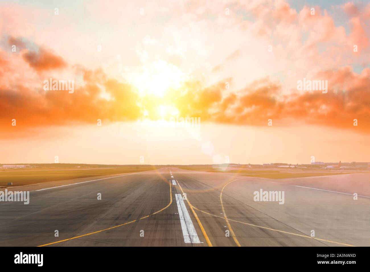 Airport empty runway in the evening sunset light, clear for airplane ...