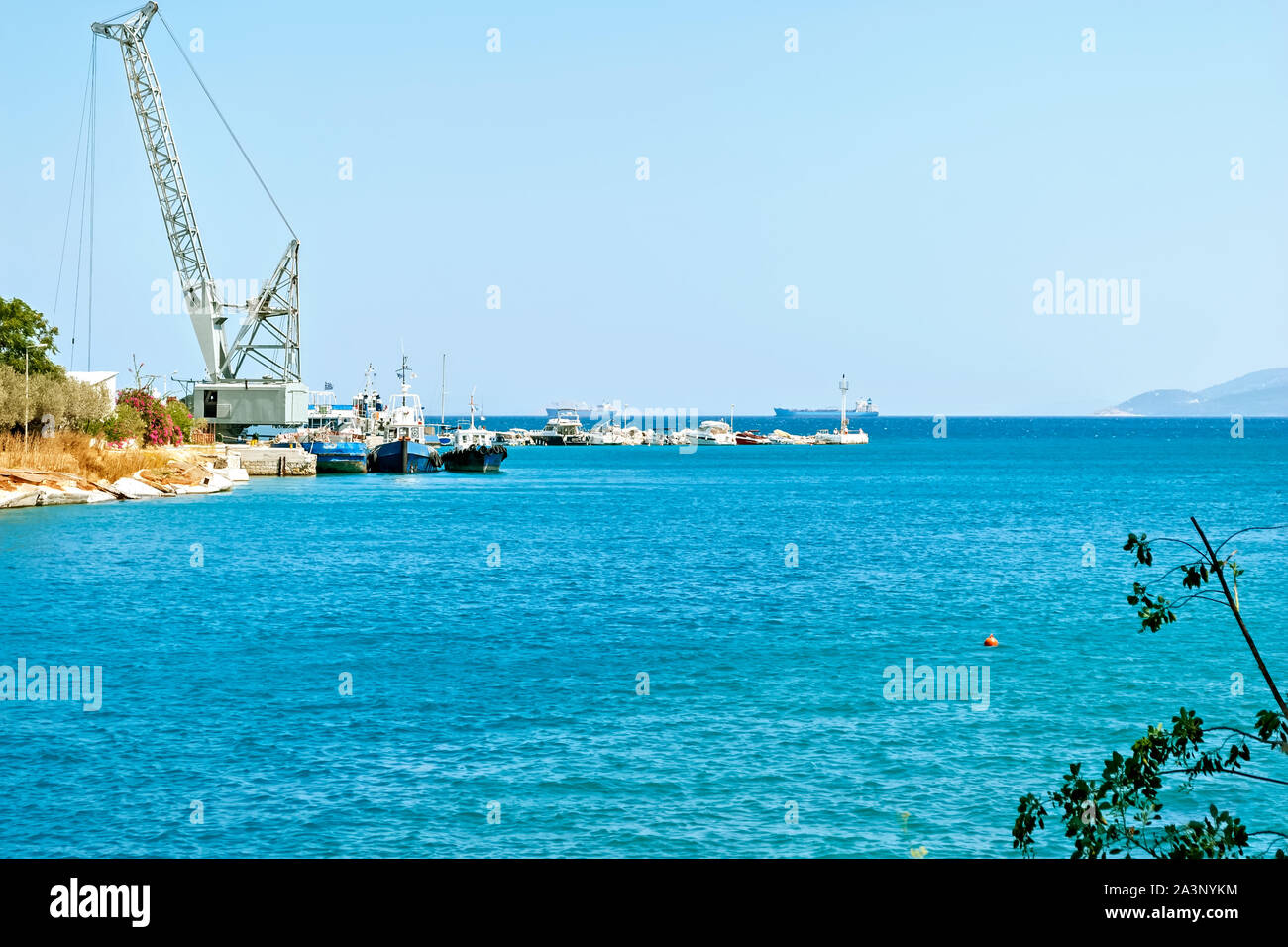 Small Greek port with ships and yachts in the Aegean Sea at the mouth ...