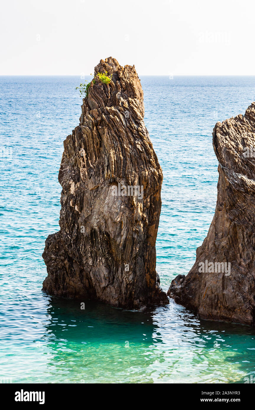 Two high rocks in the water on the beach of Monterosso Al Mare, Cinque ...