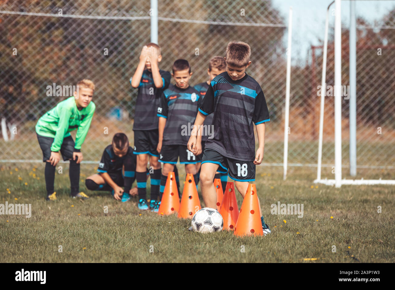 Teaching children to play football hi-res stock photography and images ...