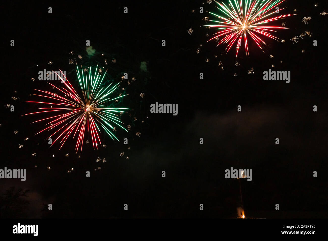 Brilliant and colorful fireworks above a illuminated church Stock Photo ...