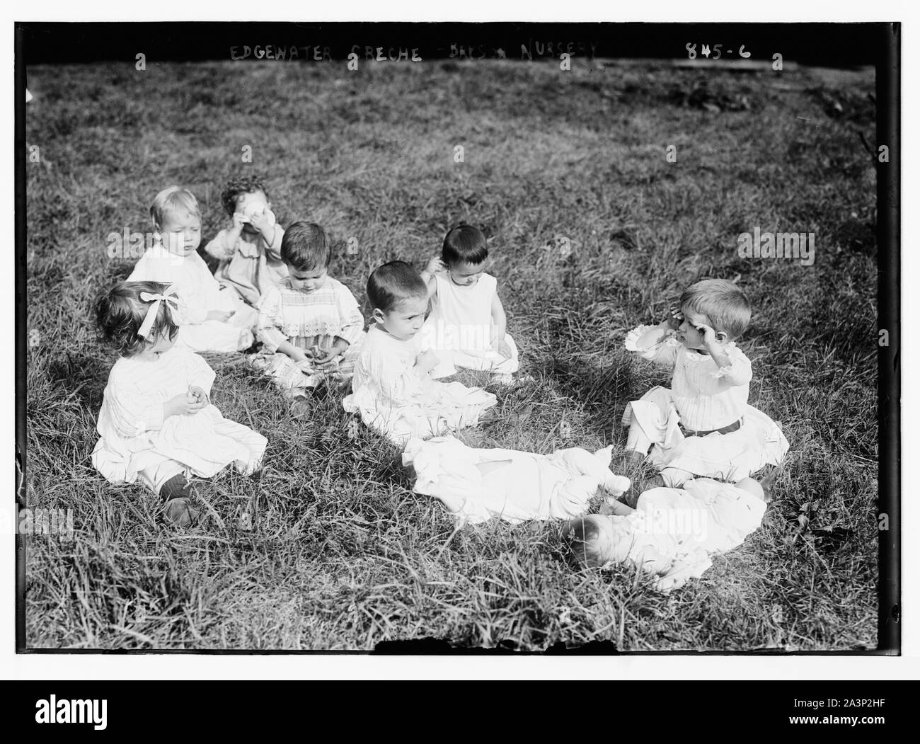 Small children on grass, Edgewater-Creche, Bryson Nursery Stock Photo ...