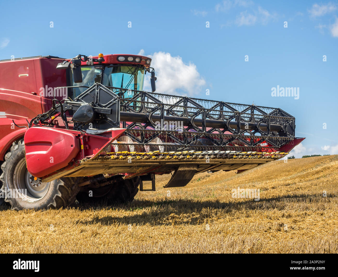 Combine harvesters at work on a field Stock Photo - Alamy