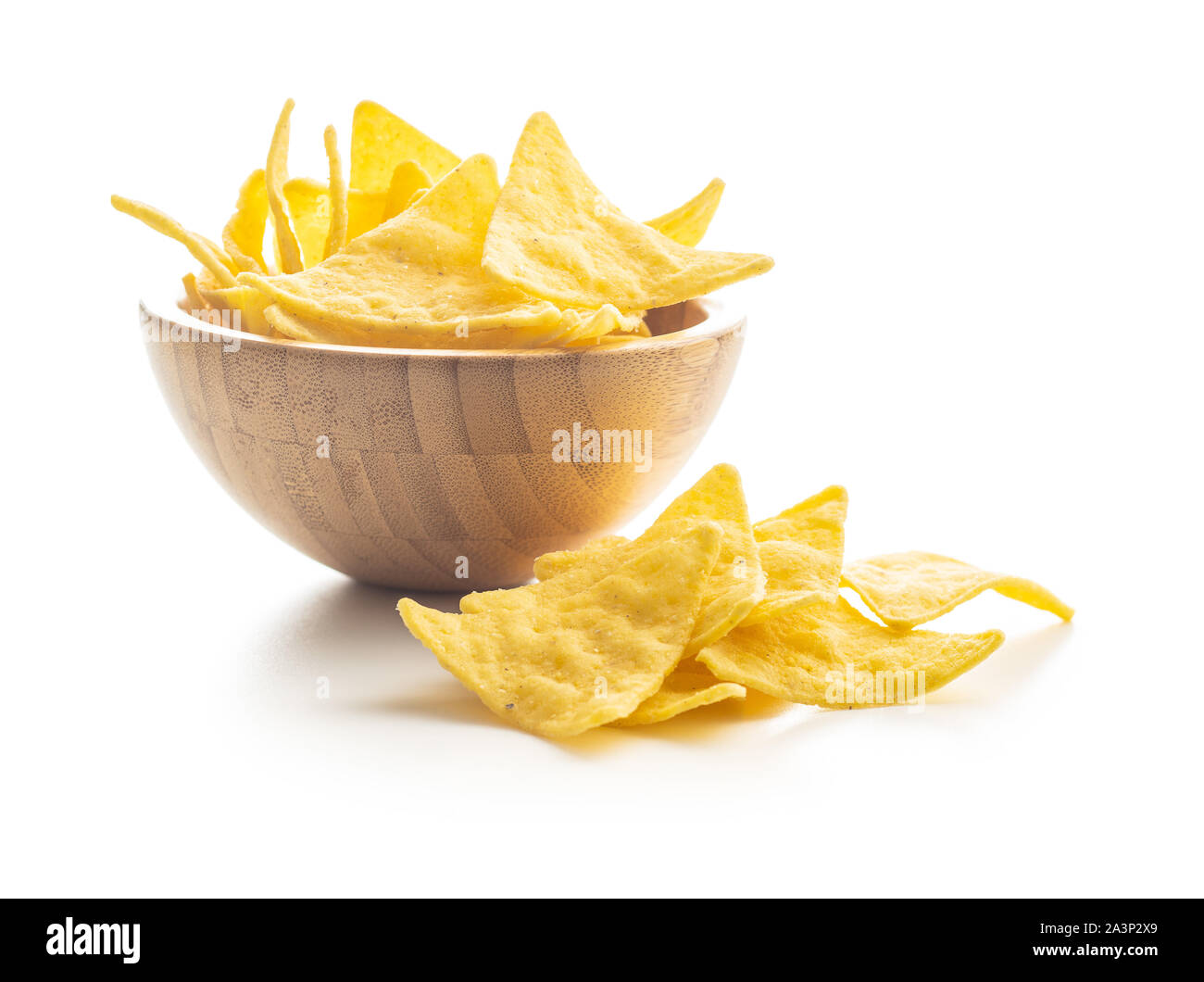 Corn nacho chips. Yellow tortilla chips in wooden bowl isolated on ...