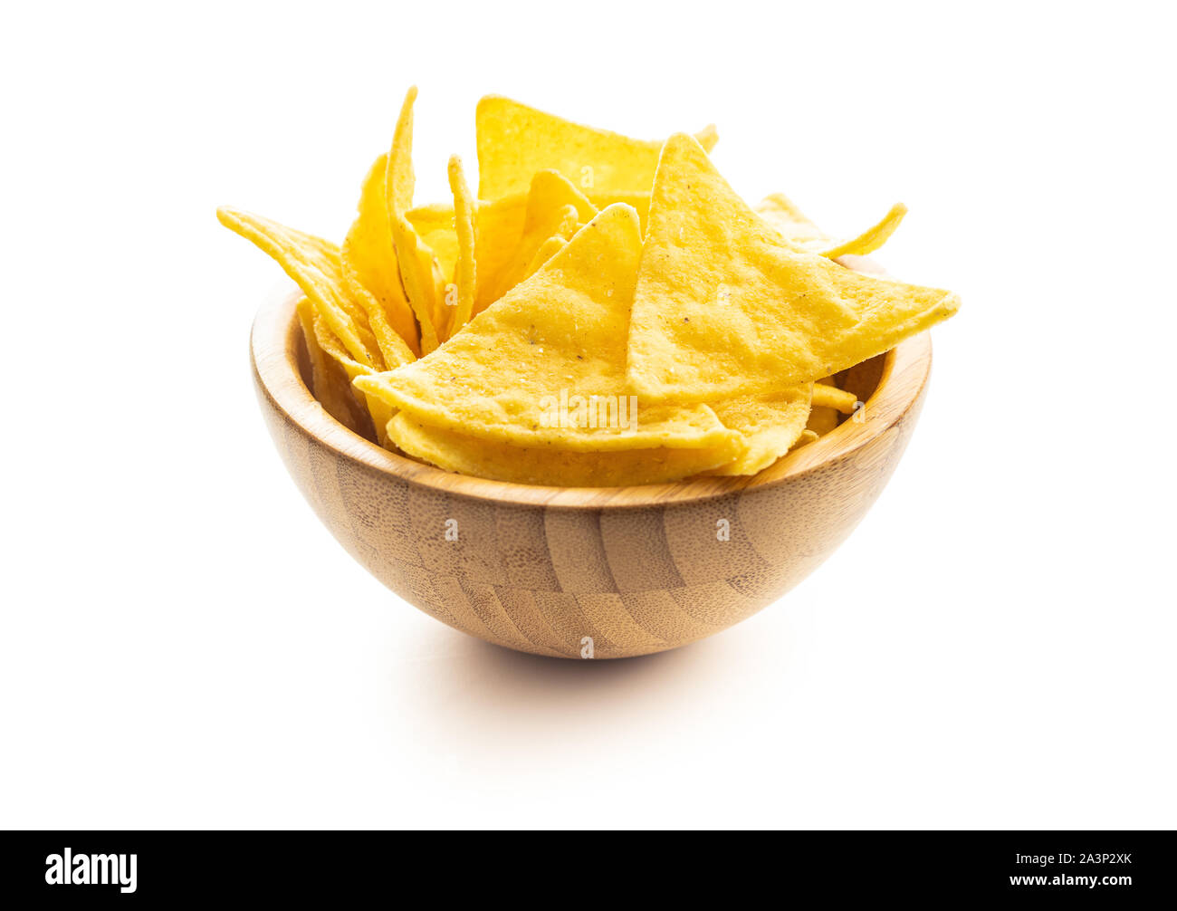 Corn nacho chips. Yellow tortilla chips in wooden bowl isolated on ...