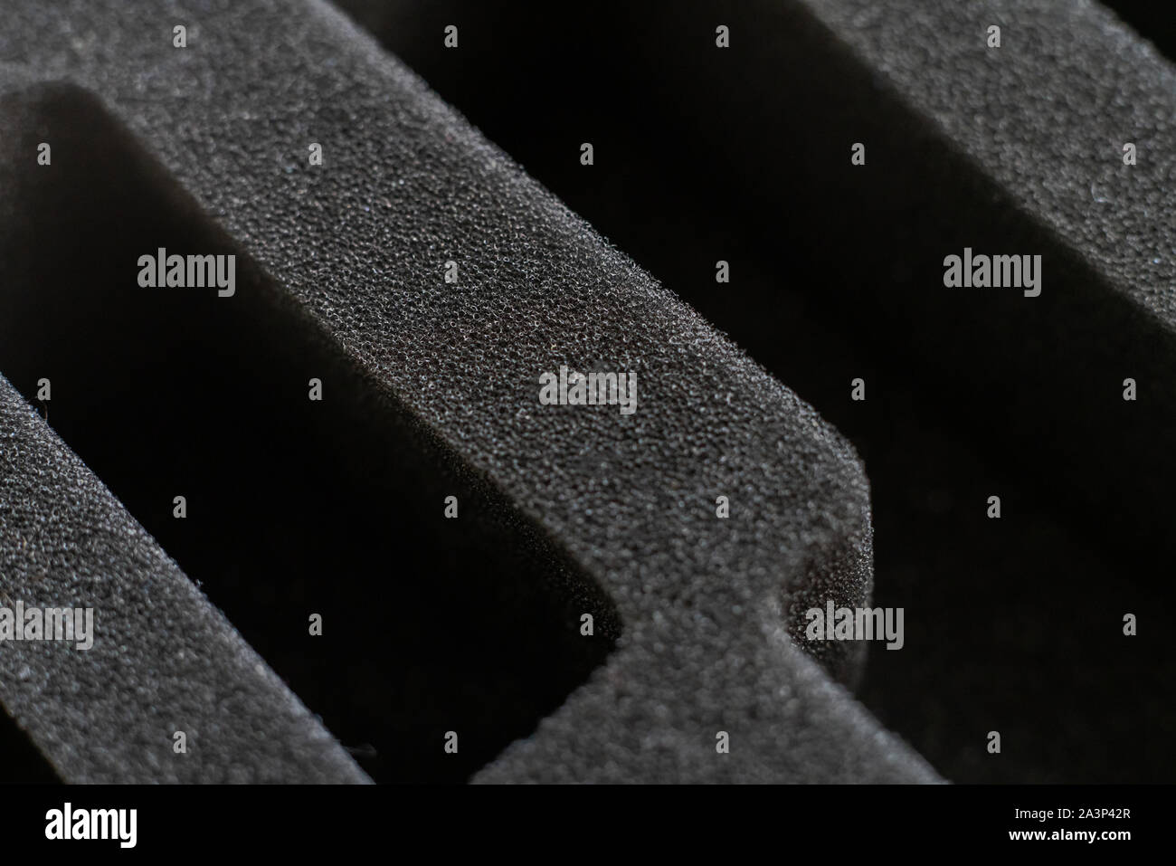 abstract dark black foam rubber texture, macro view, protection ...