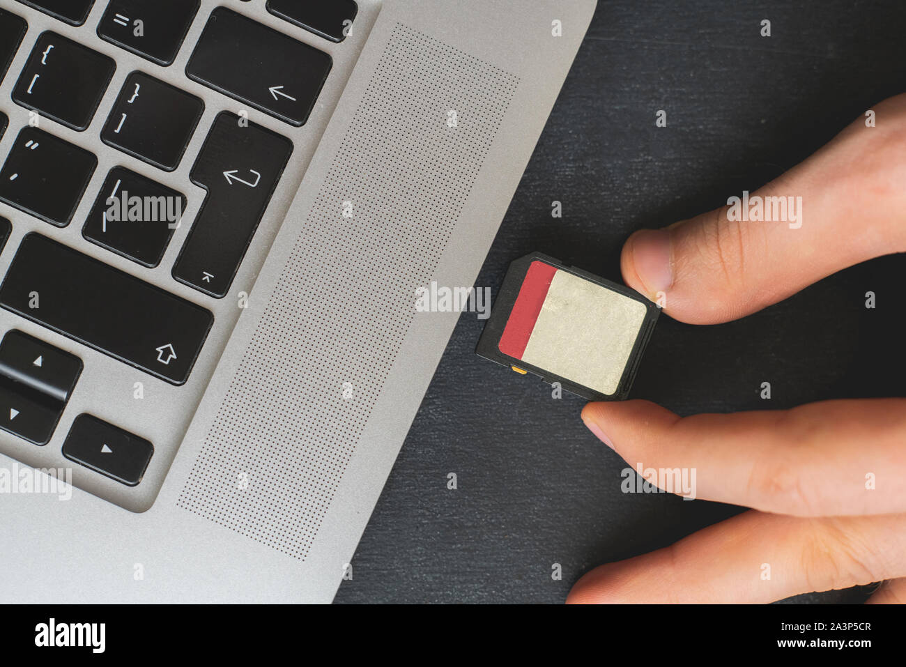 Hand insert usb memory stick hi-res stock photography and images - Alamy