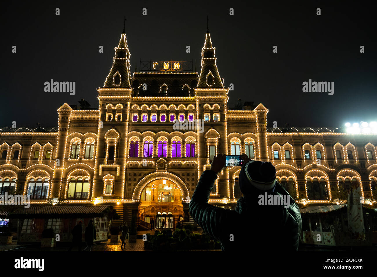 A Scotland fan takes a photo outside the GUM department store in the ...