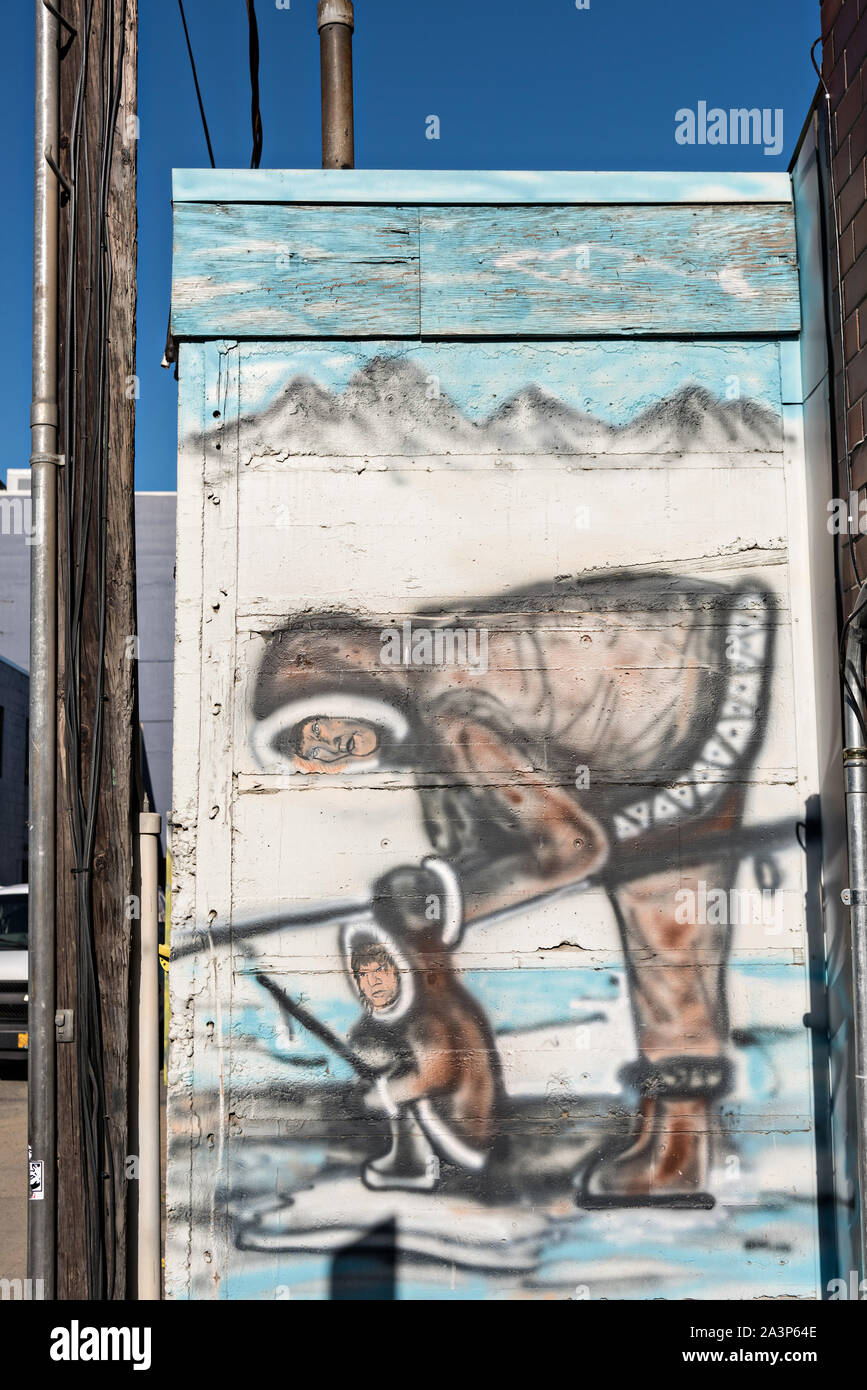 A painted wall mural of an eskimo hunting in downtown Anchorage, Alaska ...