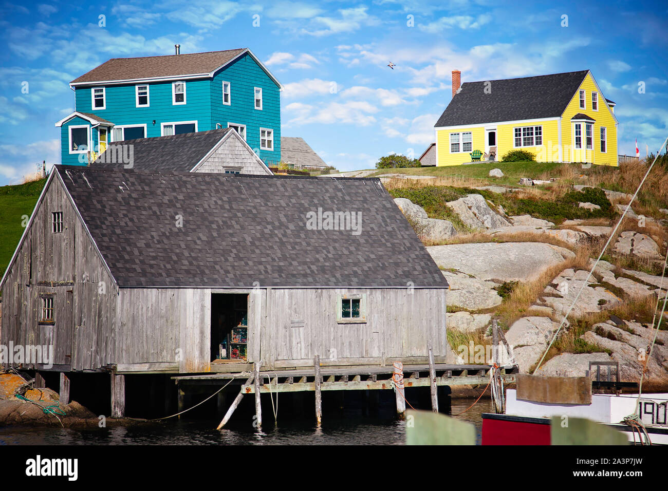 Colorful shacks line the docks in historical Peggy's Cove, Nova Scotia ...