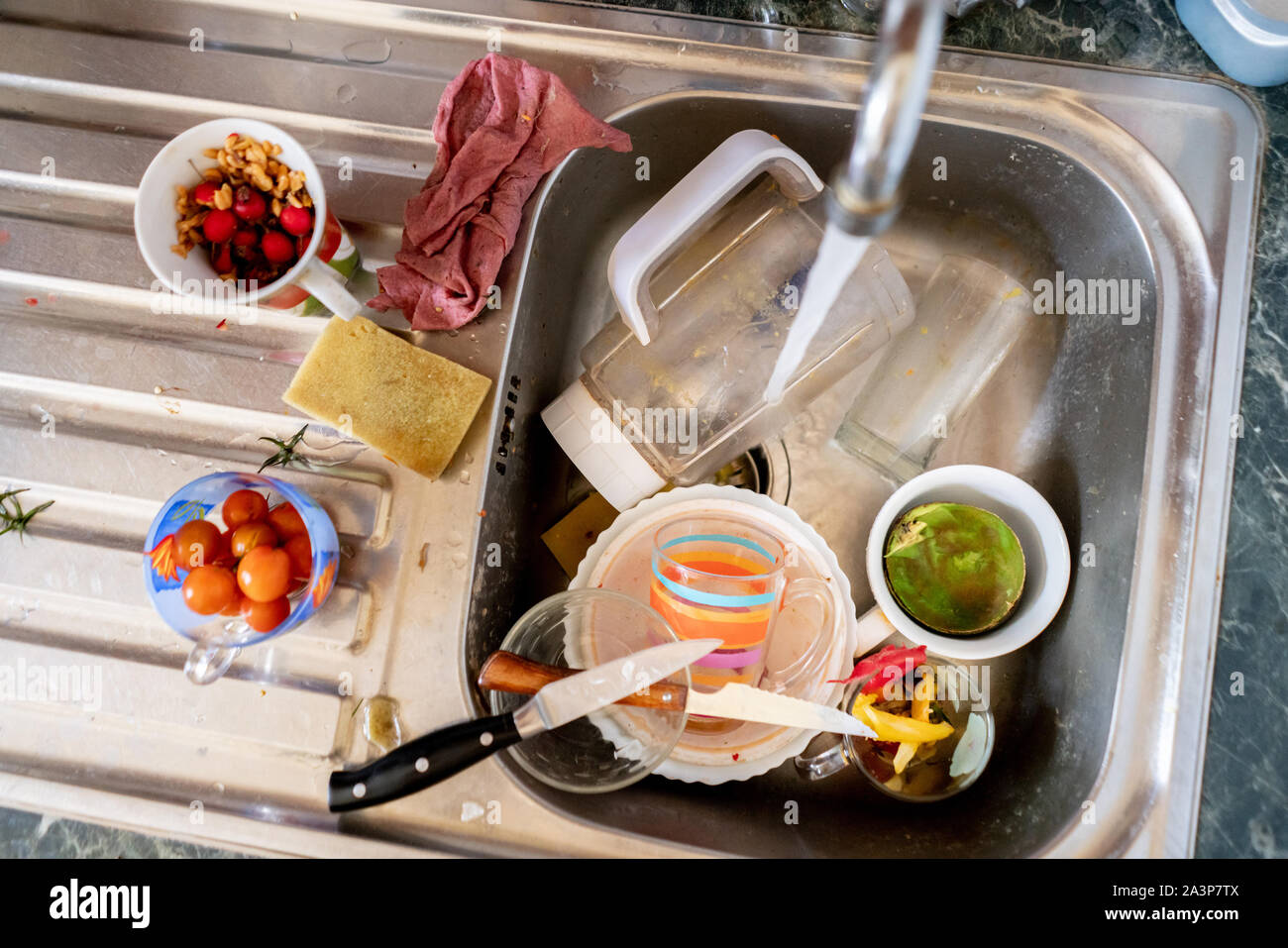 a huge bunch of dirty dish in the kithcen in the sink, housework ...