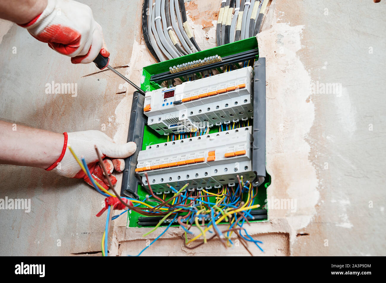 A electrician installing the fuses in the switch box Stock Photo - Alamy