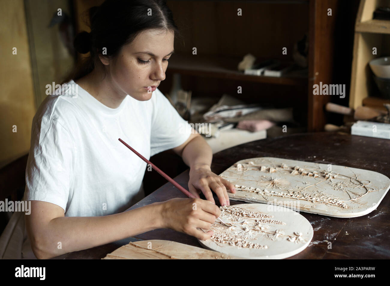 Woman creating clay sculpture hi-res stock photography and images - Alamy