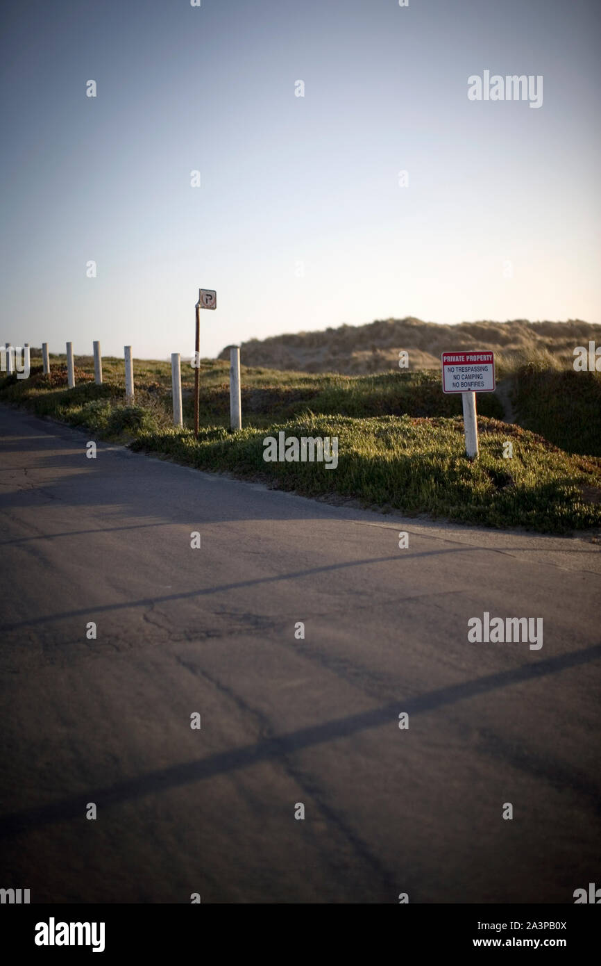 Single-lane road with a private property sign Stock Photo - Alamy