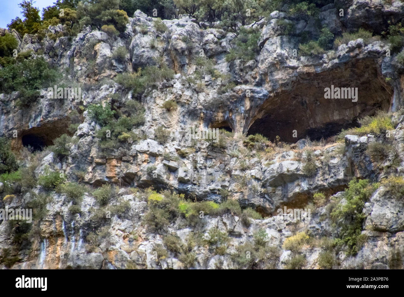 Caves in the limestone mountains. Void in the rock mountain Stock Photo ...