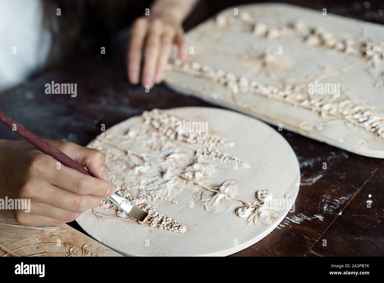Woman creating clay sculpture hi-res stock photography and images - Alamy