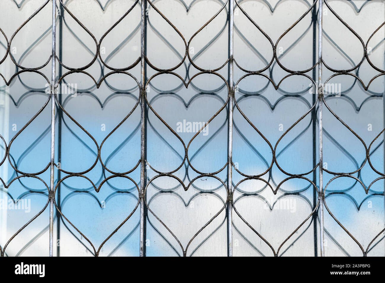 Decorative openwork metal mesh on the window for protection. The window ...