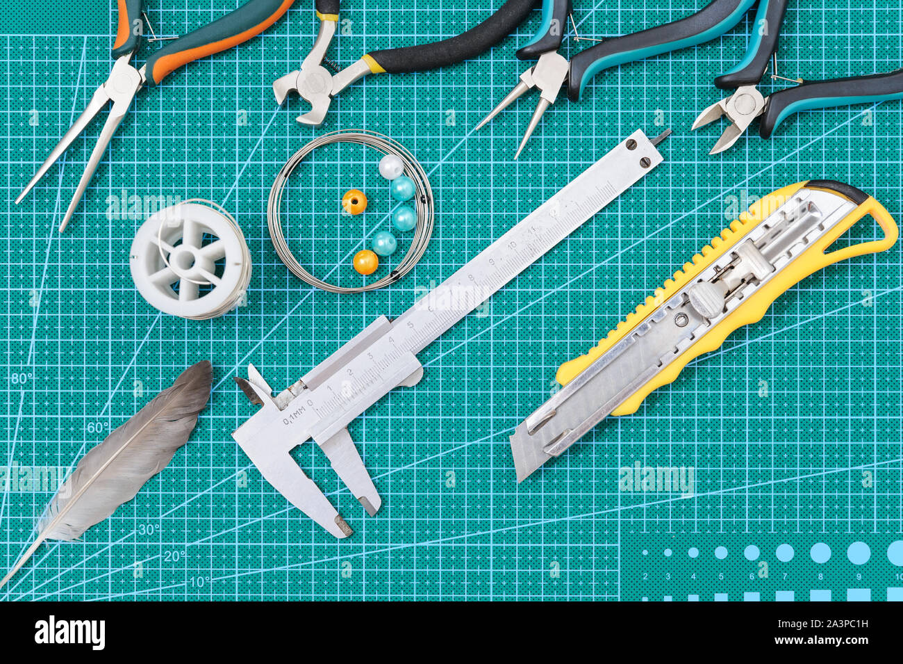 Still life with tools for handmade on the work pad Stock Photo - Alamy