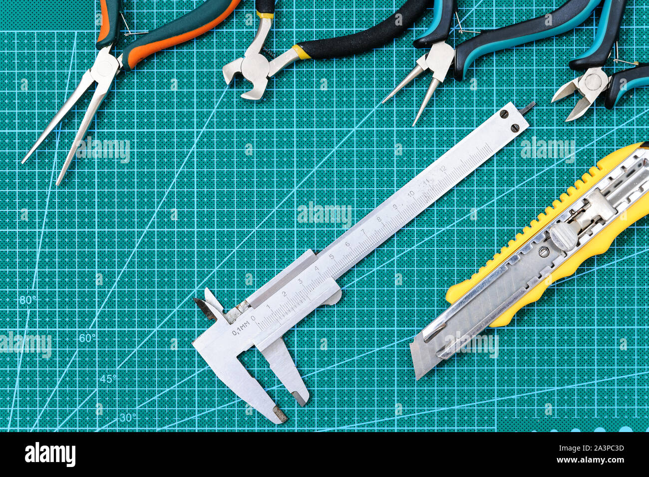 Still life with tools for handmade on the work pad Stock Photo - Alamy