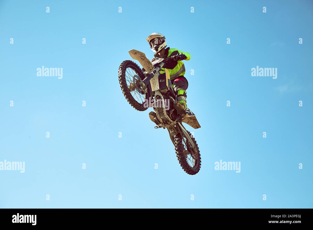 Motorcyclist isolated on blue sky background. Extreme concept, long ...