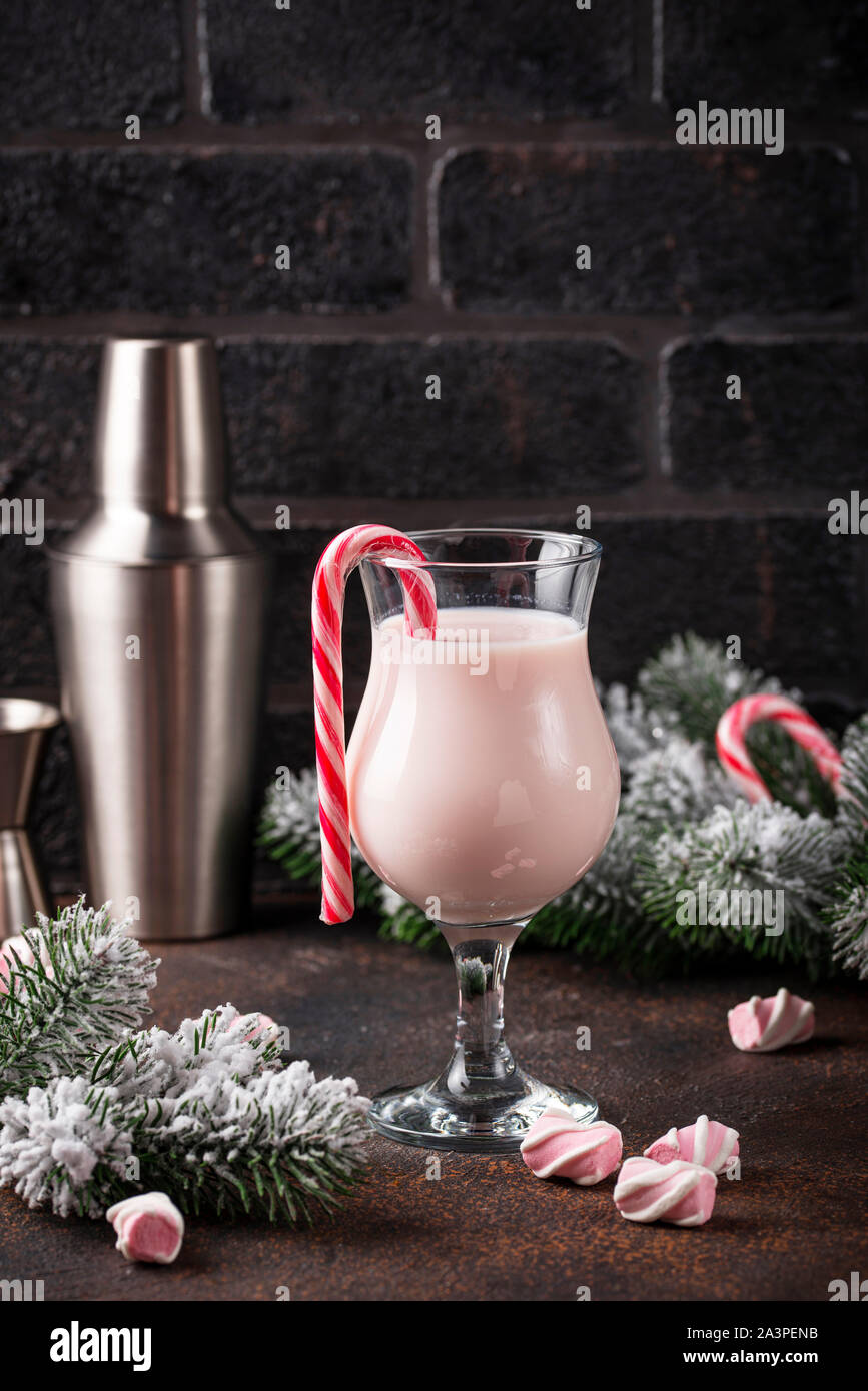 Pink Christmas cocktail with marshmallow Stock Photo - Alamy