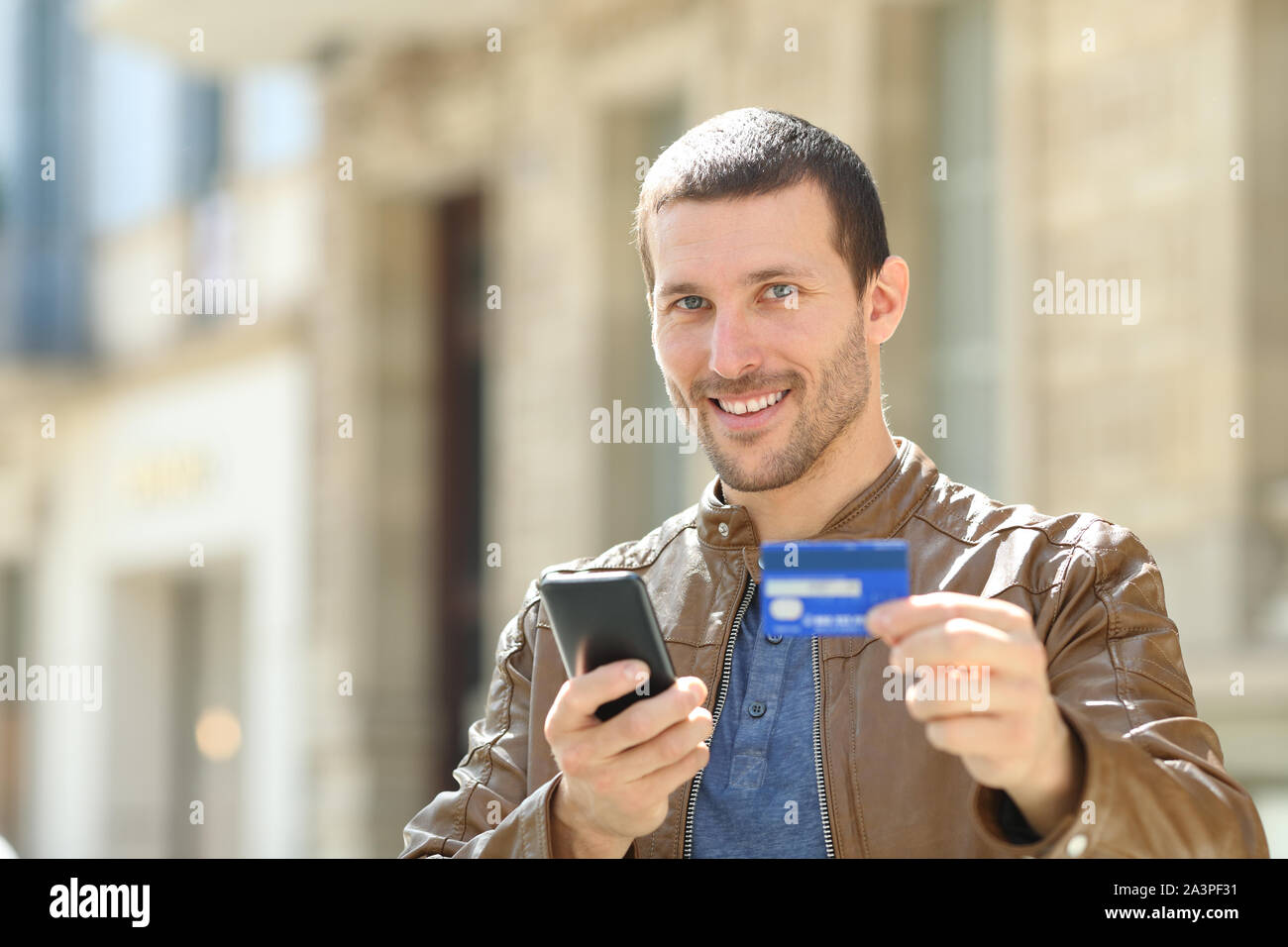 Entrepreneur holding smartphone bank card hi-res stock photography and ...