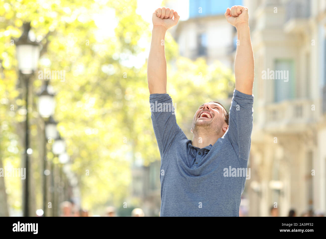 Man raising arms hi-res stock photography and images - Alamy