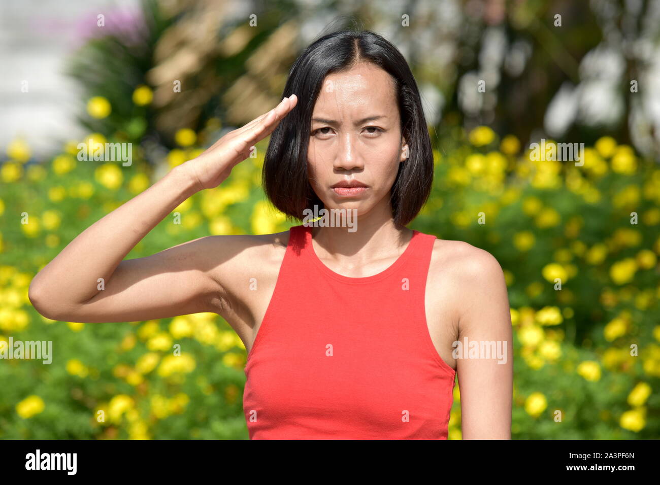 Minority Female Saluting Stock Photo - Alamy