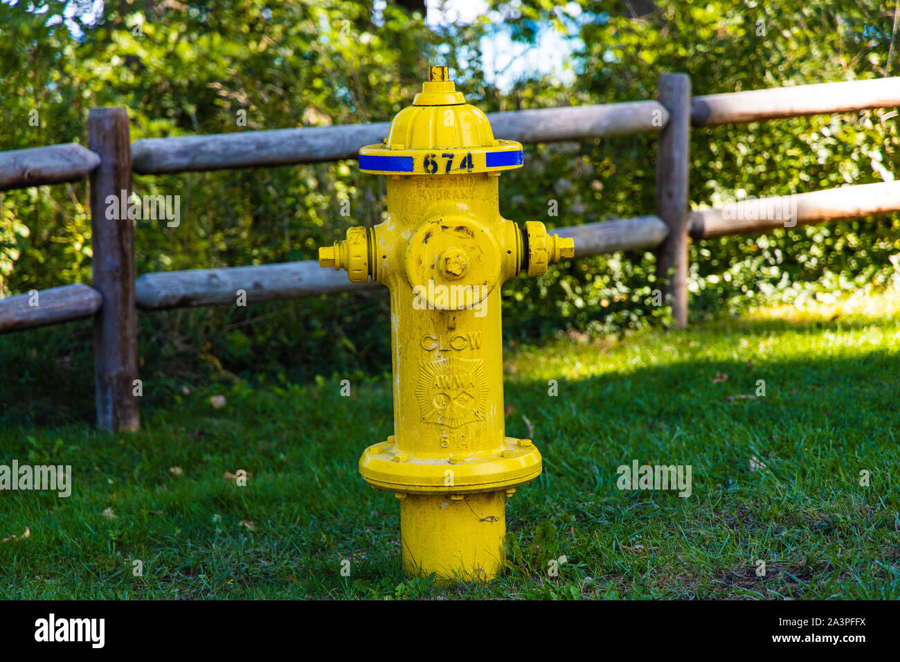 bright yellow fire hydrant Stock Photo - Alamy