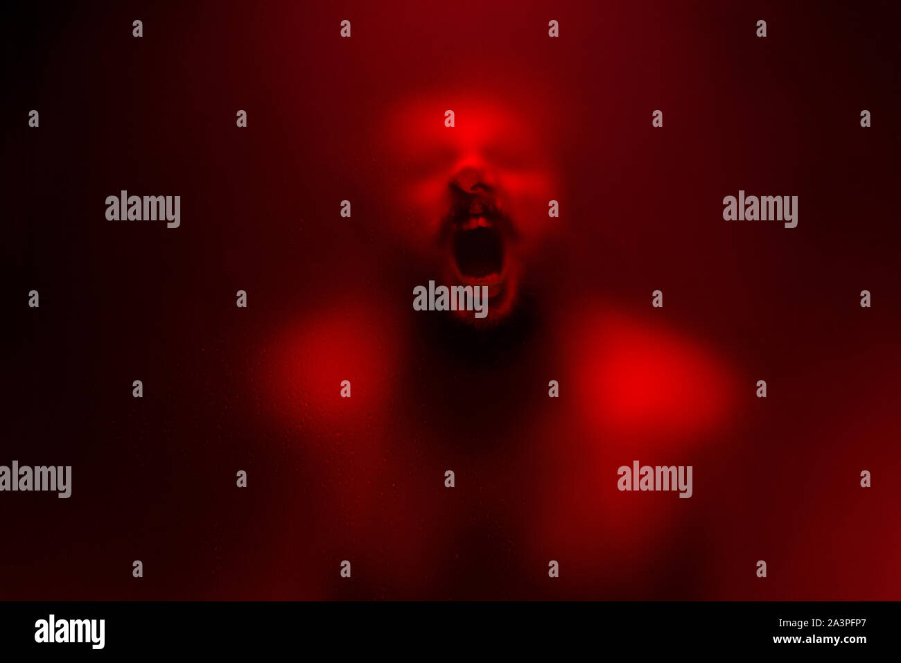 Red color filter version of Creepy man screaming behind the frosted ...