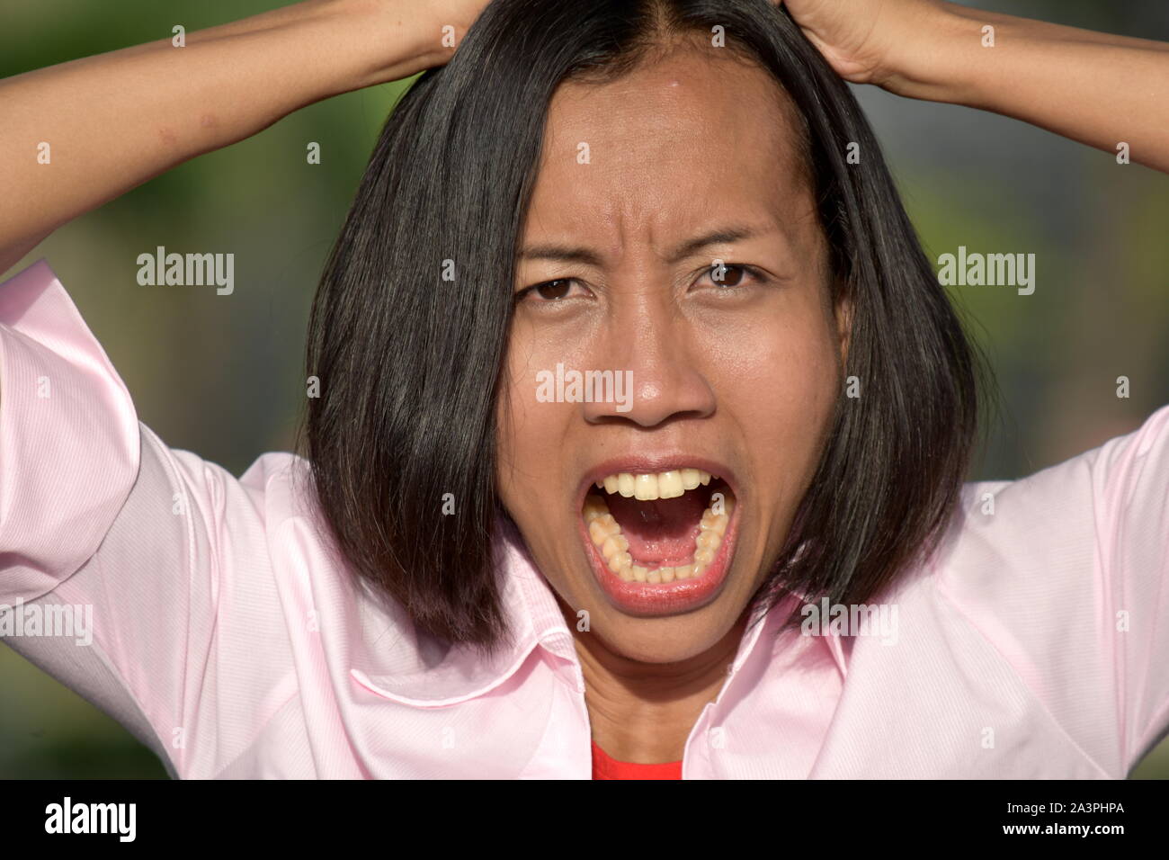 Beautiful Asian Female Under Stress Stock Photo - Alamy