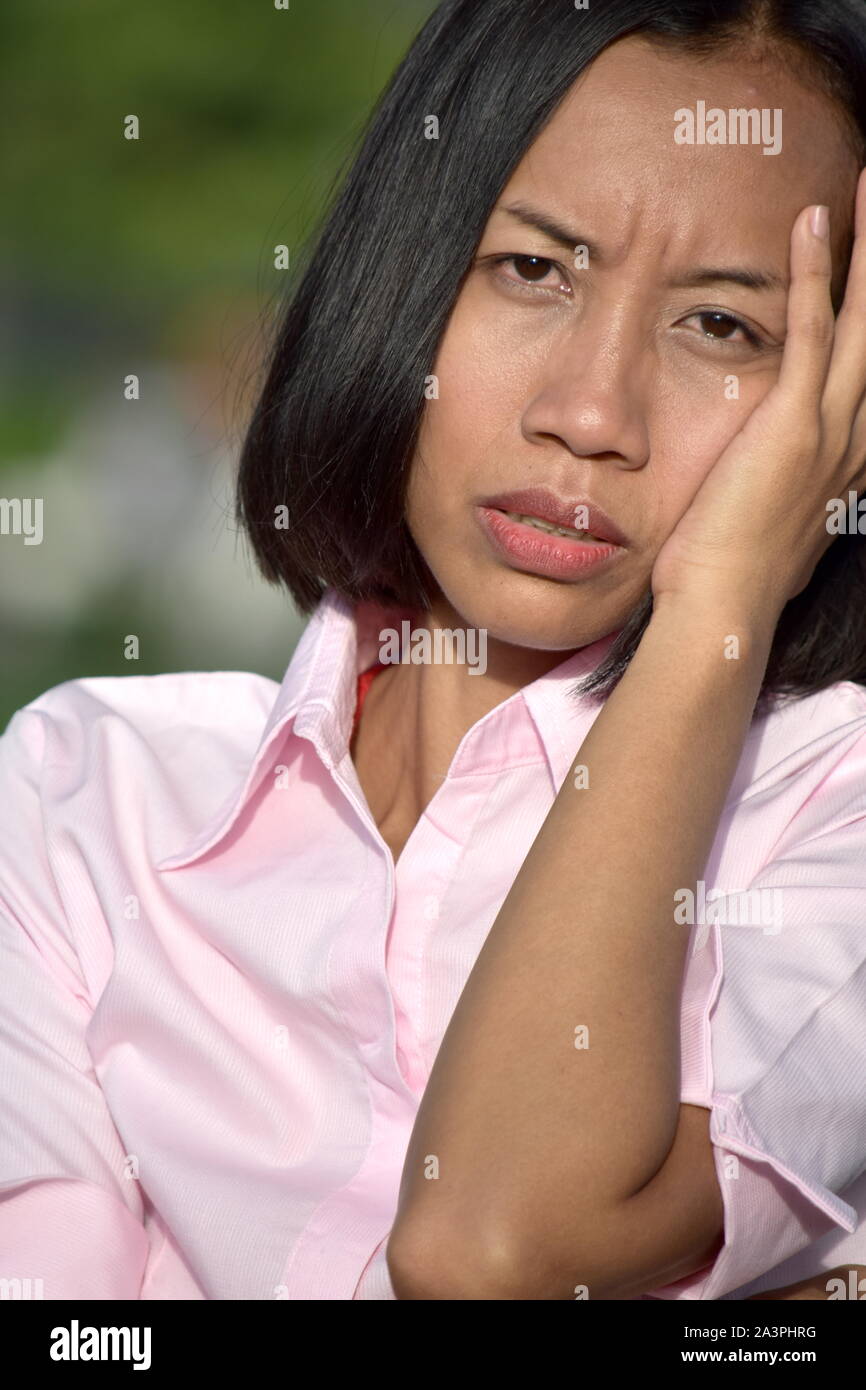 Worrisome Asian Adult Female Stock Photo - Alamy