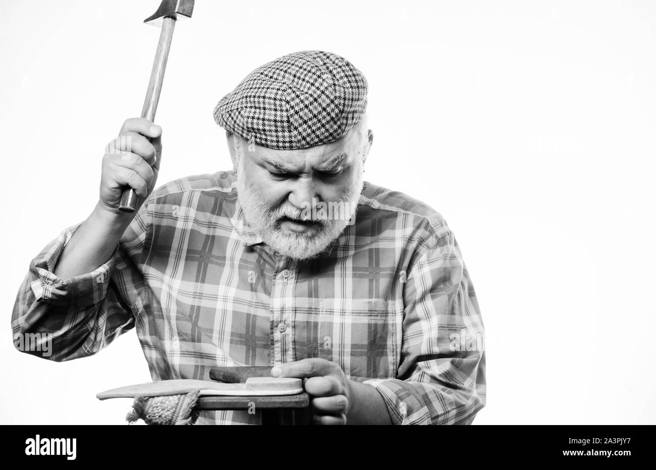 retro man repair shoes with hammer. Cobbler workmanship. shoemaker at ...