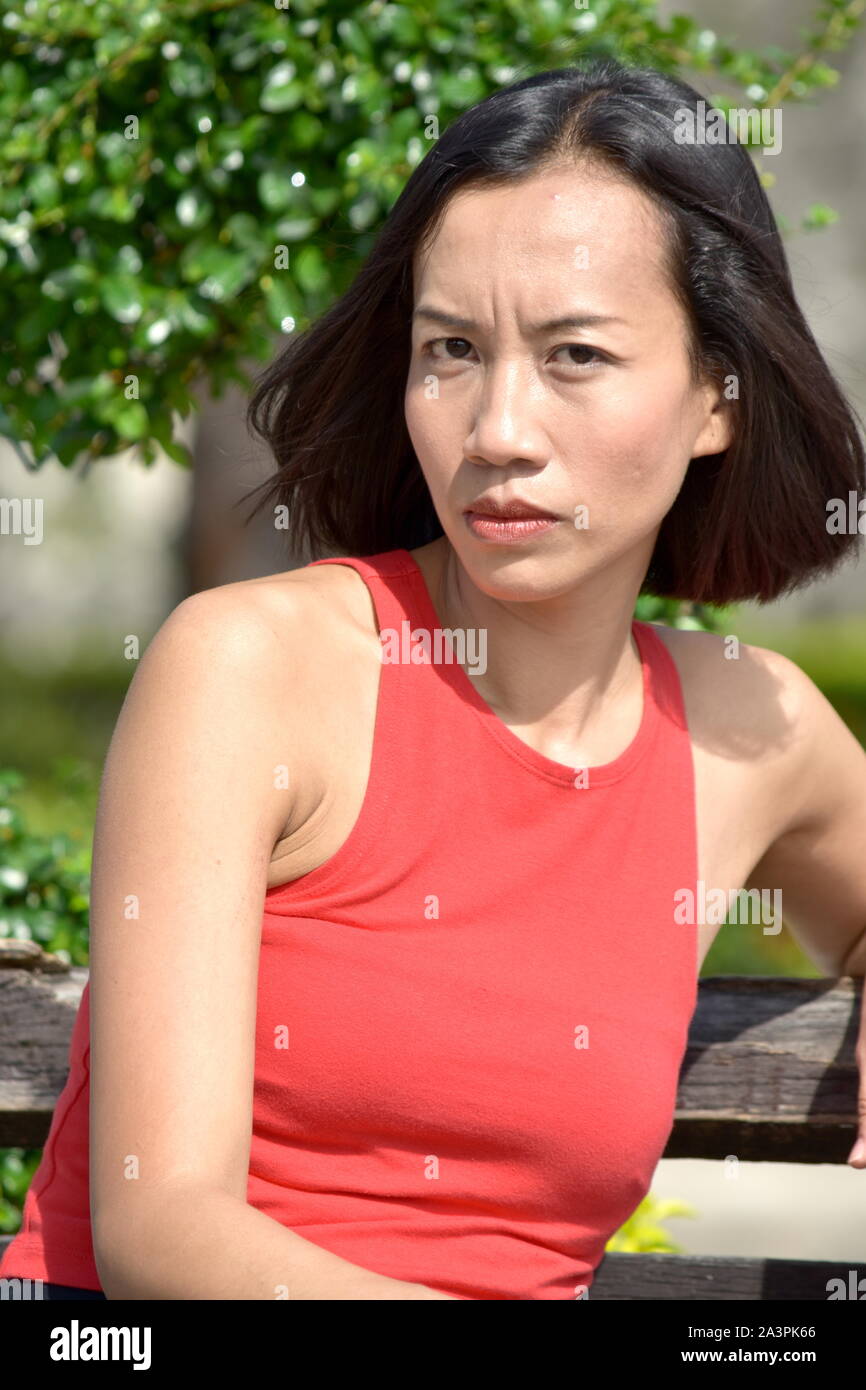 An Unemotional Pretty Asian Person Stock Photo - Alamy