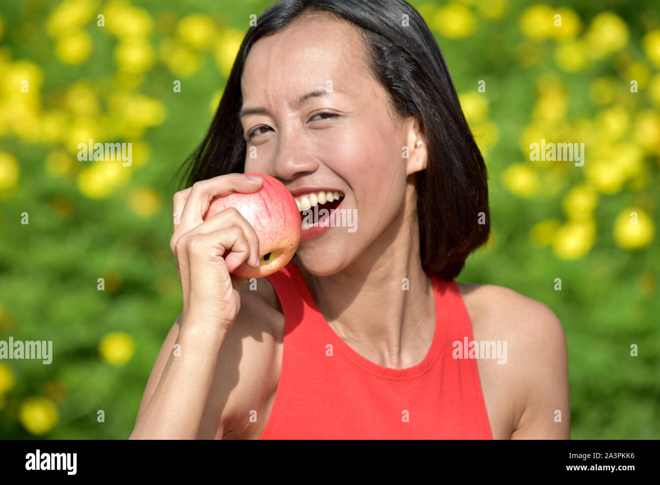 Diverse Female Eating With An Apple Stock Photo - Alamy