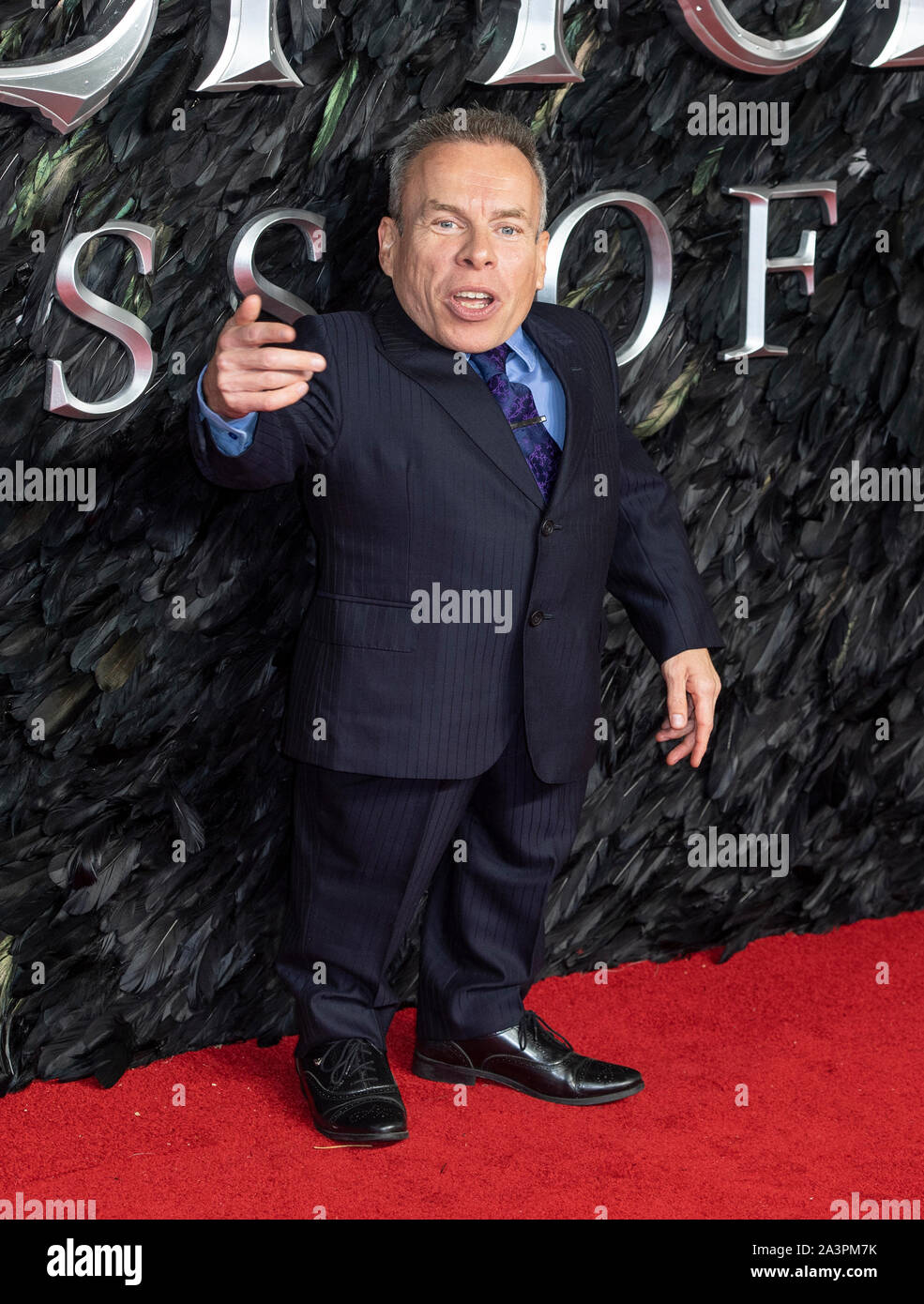 LONDON - ENGLAND - OCT 9. Warwick Davis attends the ‘Maleficent ...