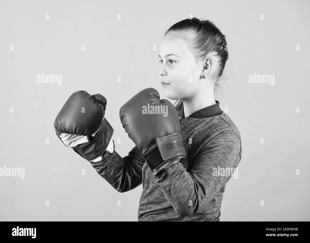 Girl cute boxer on blue background. Contrary to stereotype. Boxer child ...
