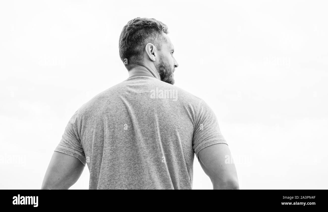 Strong muscular body feeling powerful rear view. Successful athlete ...