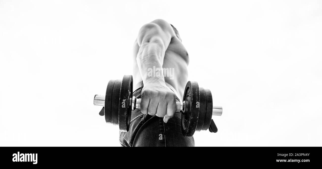 Anabolic steroids types uses and risks. Muscular man exercising with ...