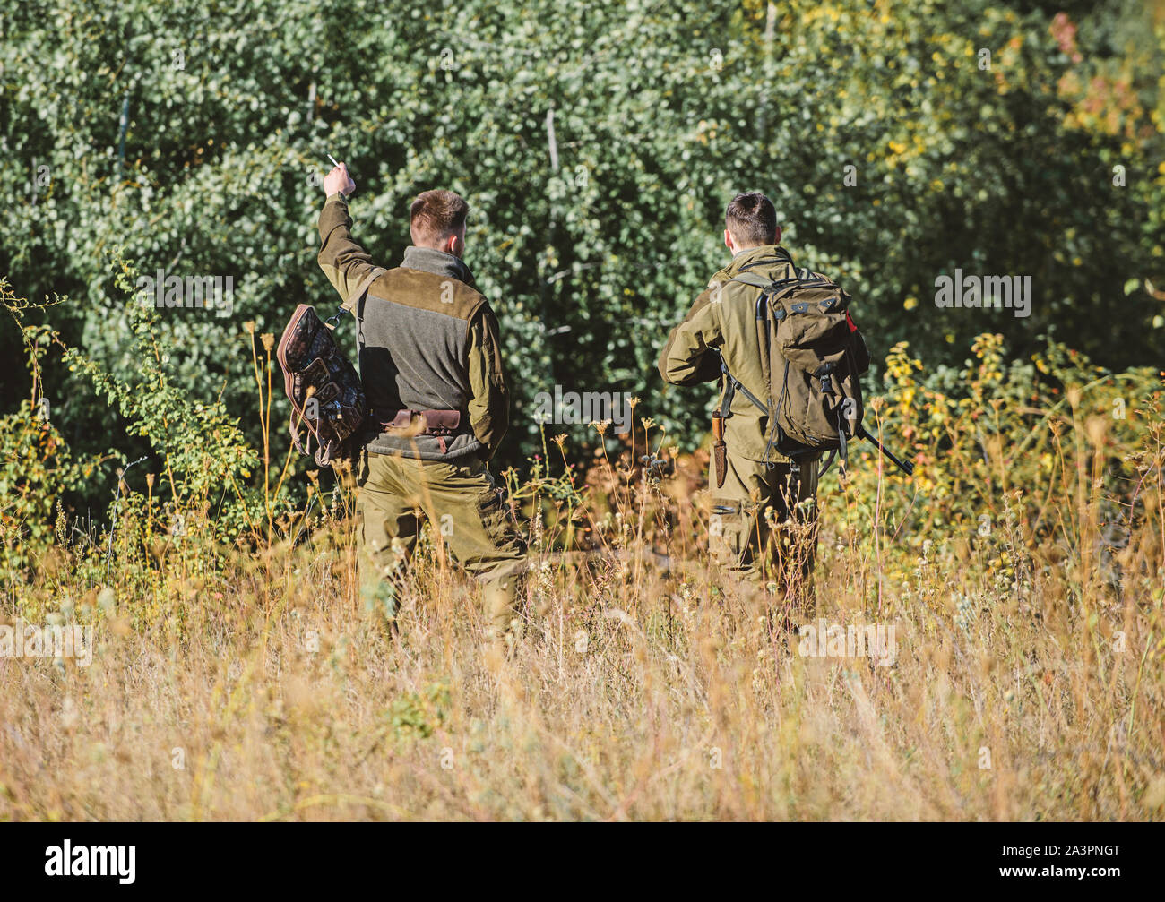 Hunters gamekeepers looking for animal or bird. Hunting with friends ...